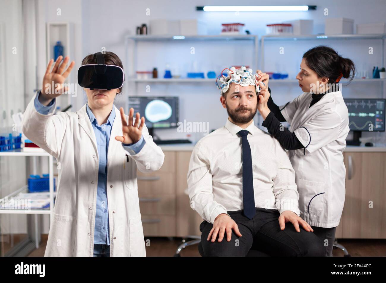 Neuroscientist developing diagnosis wearing virtual reality headset in ...