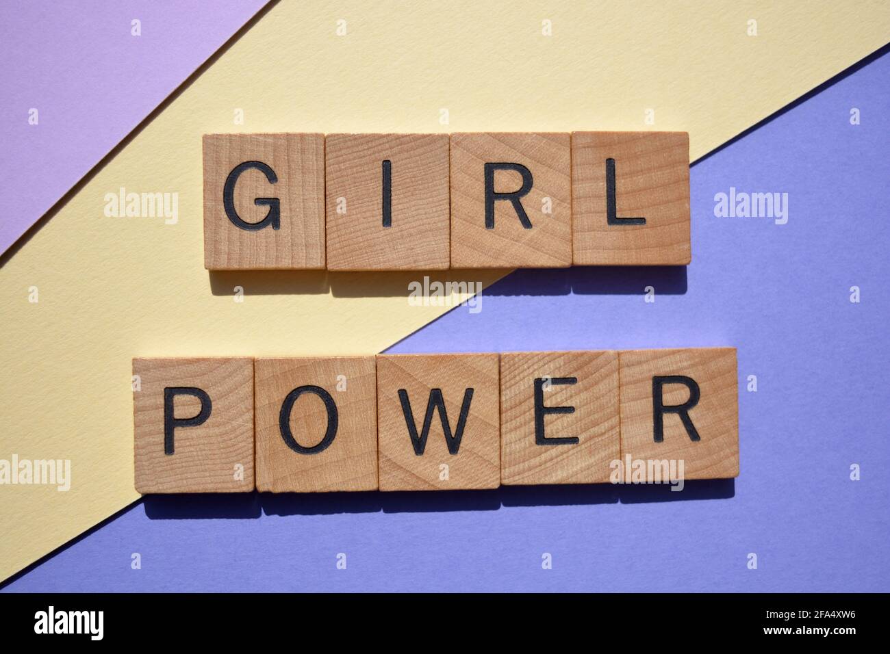 Girl Power, words in wooden alphabet letters isolated on colourful ...
