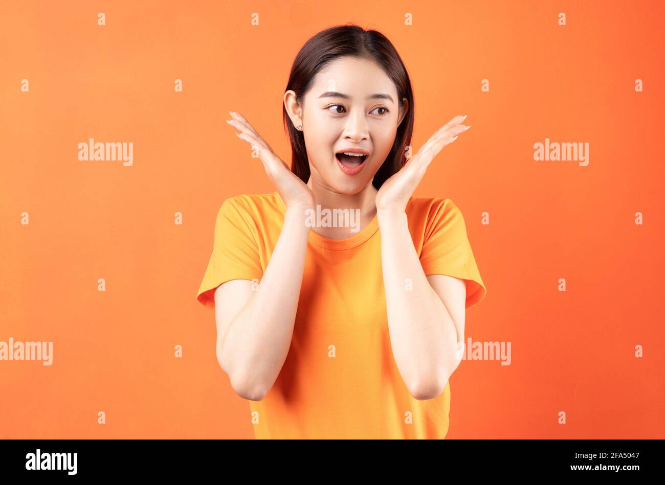Young Asian woman is feeling extremely excited Stock Photo - Alamy