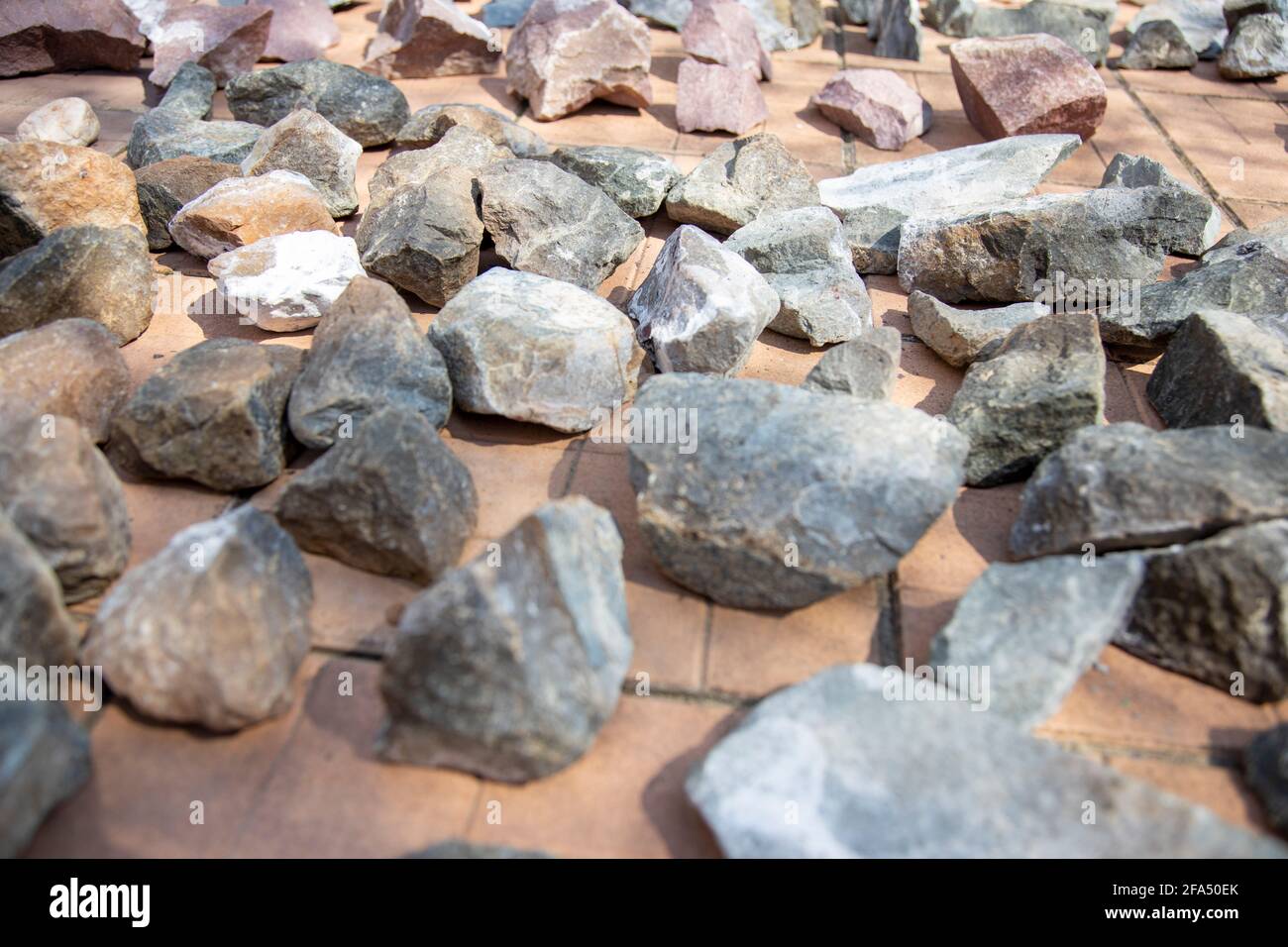 Sauna stones are on the tiles and dry fter cleaning Stock Photo - Alamy