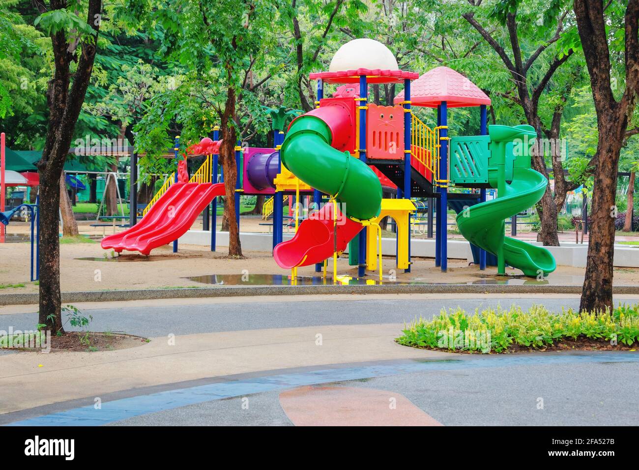 Playground in the park With green trees suitable for children Stock ...