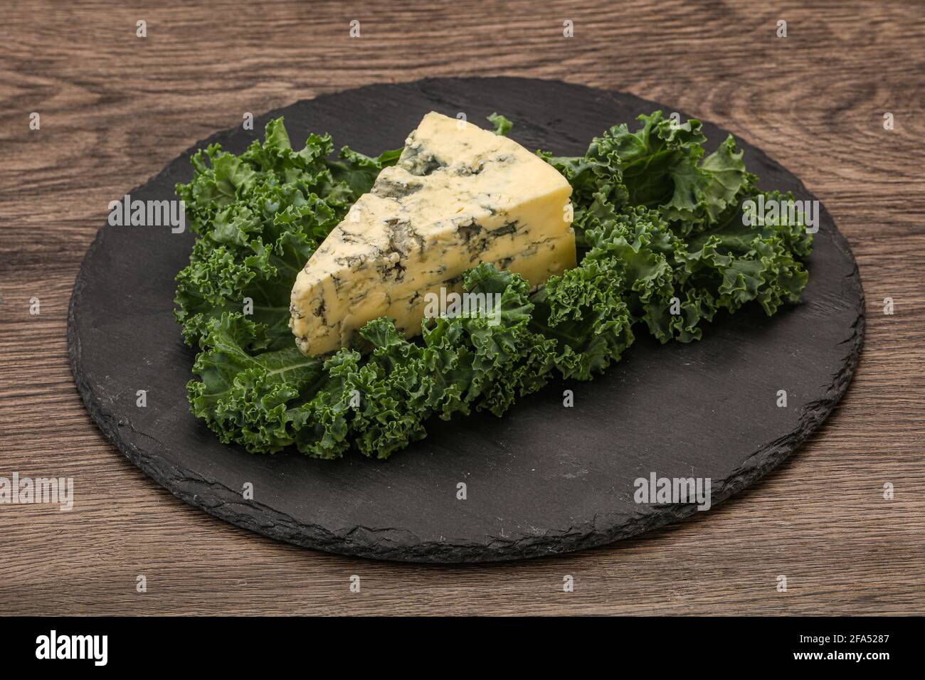Dairy Blue cheese triangle with mold Stock Photo - Alamy