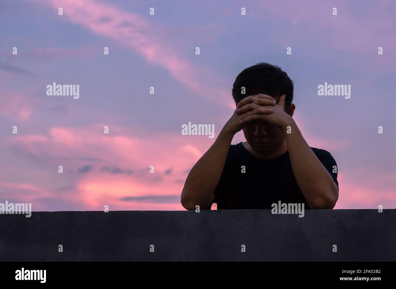 Asian miserable depressed man stay alone with sky background ...