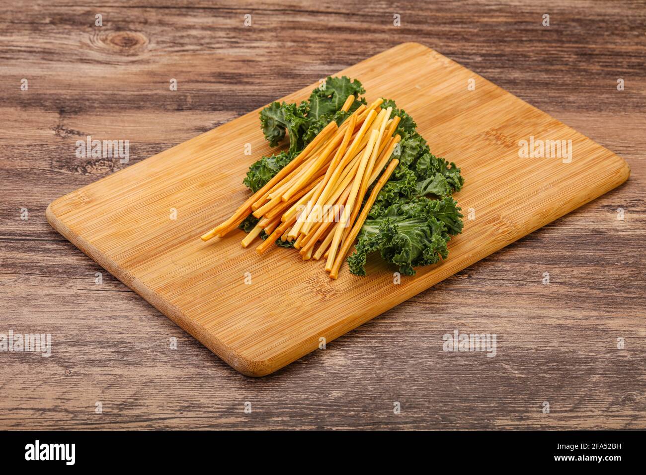 Caucasian Chechel cheese sticks over board Stock Photo - Alamy