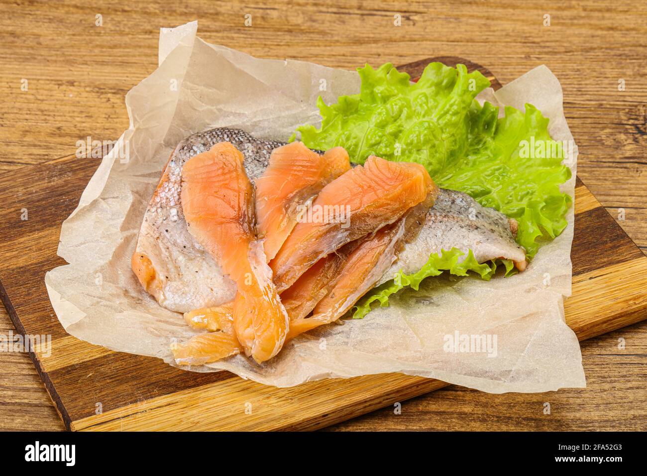 Sliced natural wild trout fillet over board Stock Photo - Alamy
