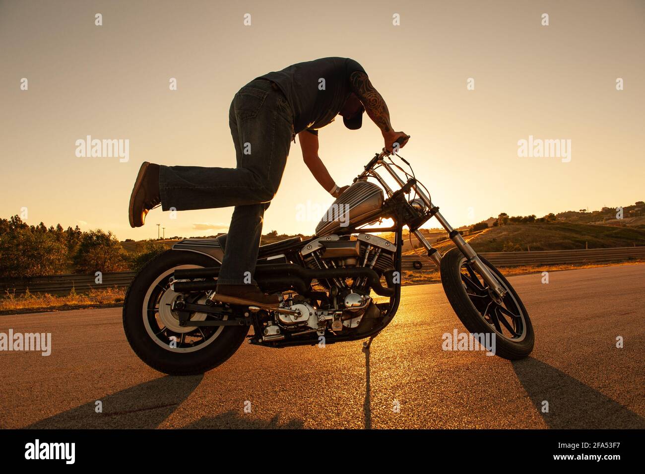 motorcyclist turns on the motorcycle Stock Photo - Alamy