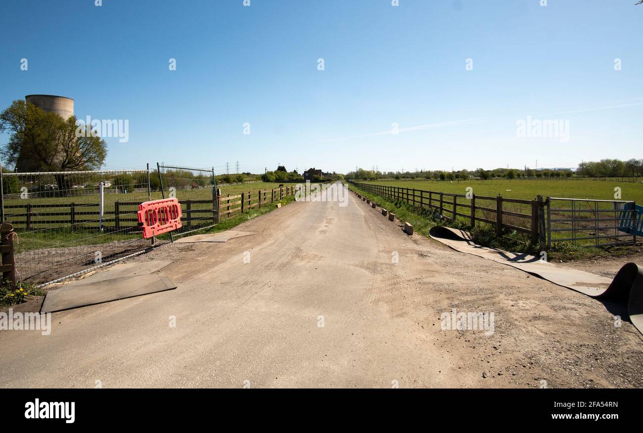 Long straight dry country road example Stock Photo - Alamy