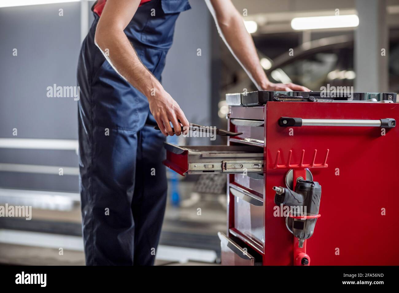 Male hands with working tool in workshop Stock Photo - Alamy