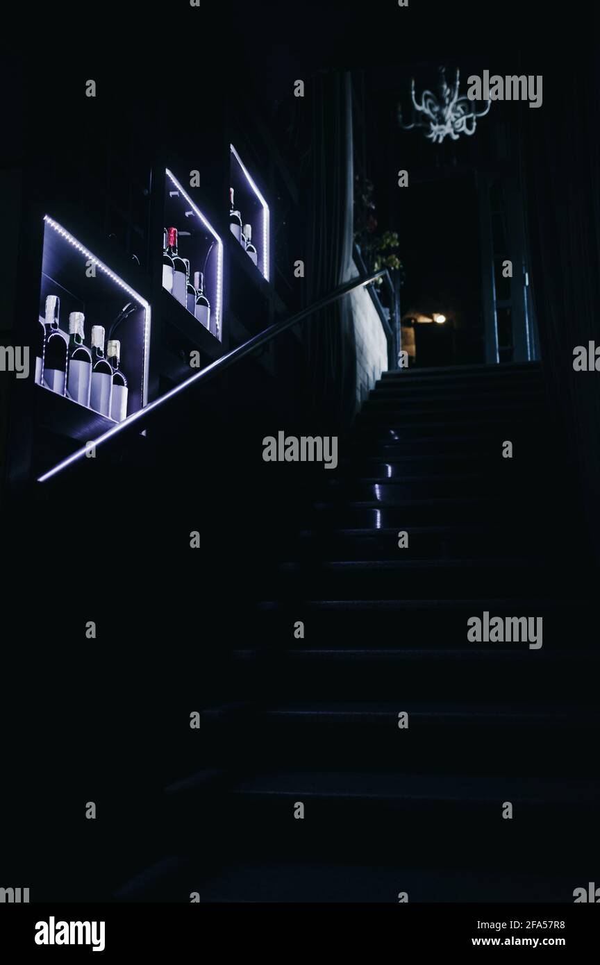 stairs to the bar with alcoholic beverages on the shelf Stock Photo - Alamy
