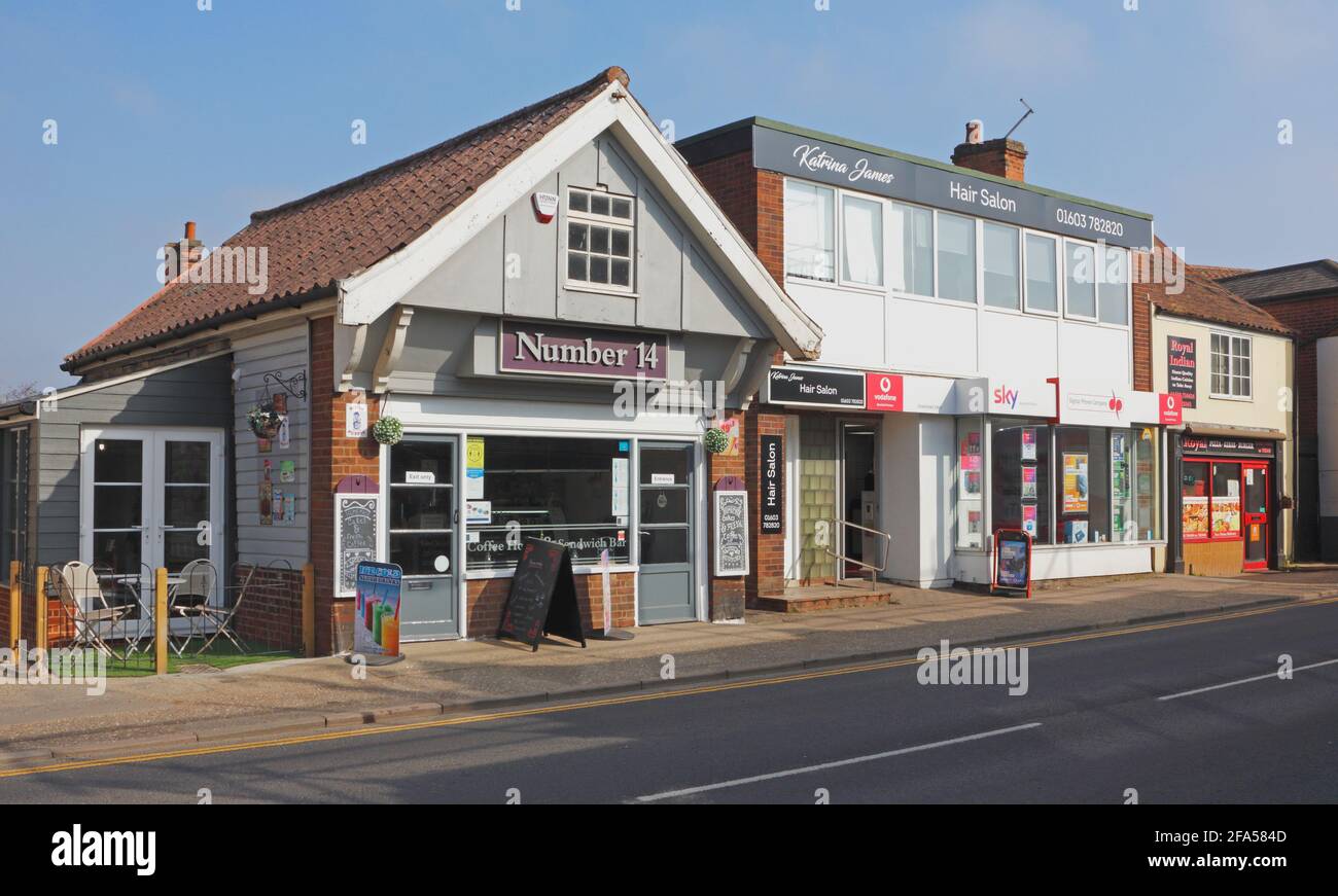 A view of shop fronts by the A1151 road north of Wroxham Bridge on the ...