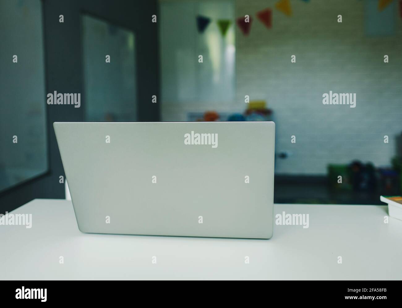 Laptop or notebook on wood table in blurry background with house or ...