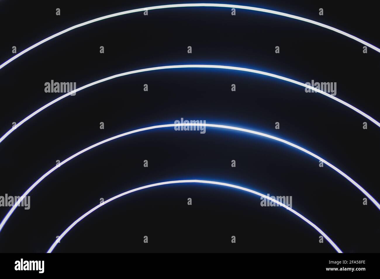 abstract futuristic lighting on the ceiling in a dark interior. modern ...