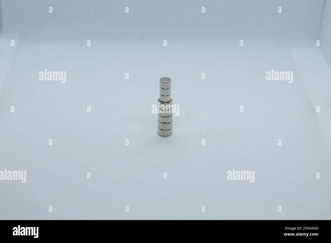 Pile of magnets stacked upon one another Stock Photo - Alamy