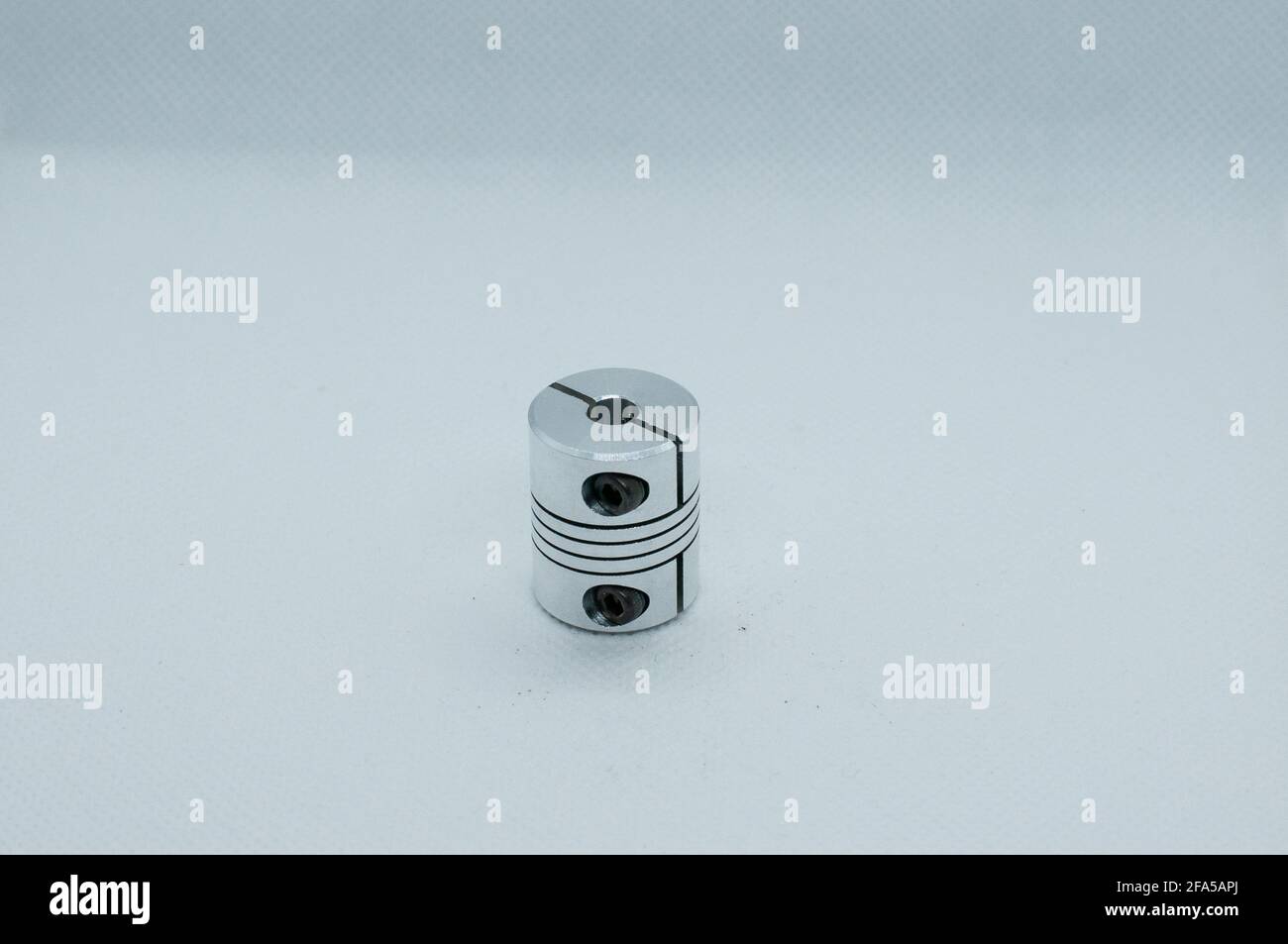 Shaft coupling set on a smooth white background Stock Photo - Alamy