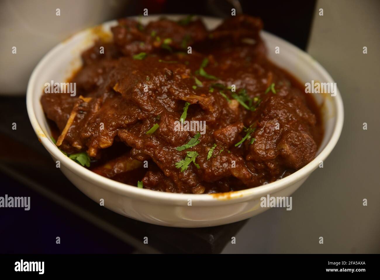 Closeup shot of mutton kossa served in a white bowl Stock Photo - Alamy