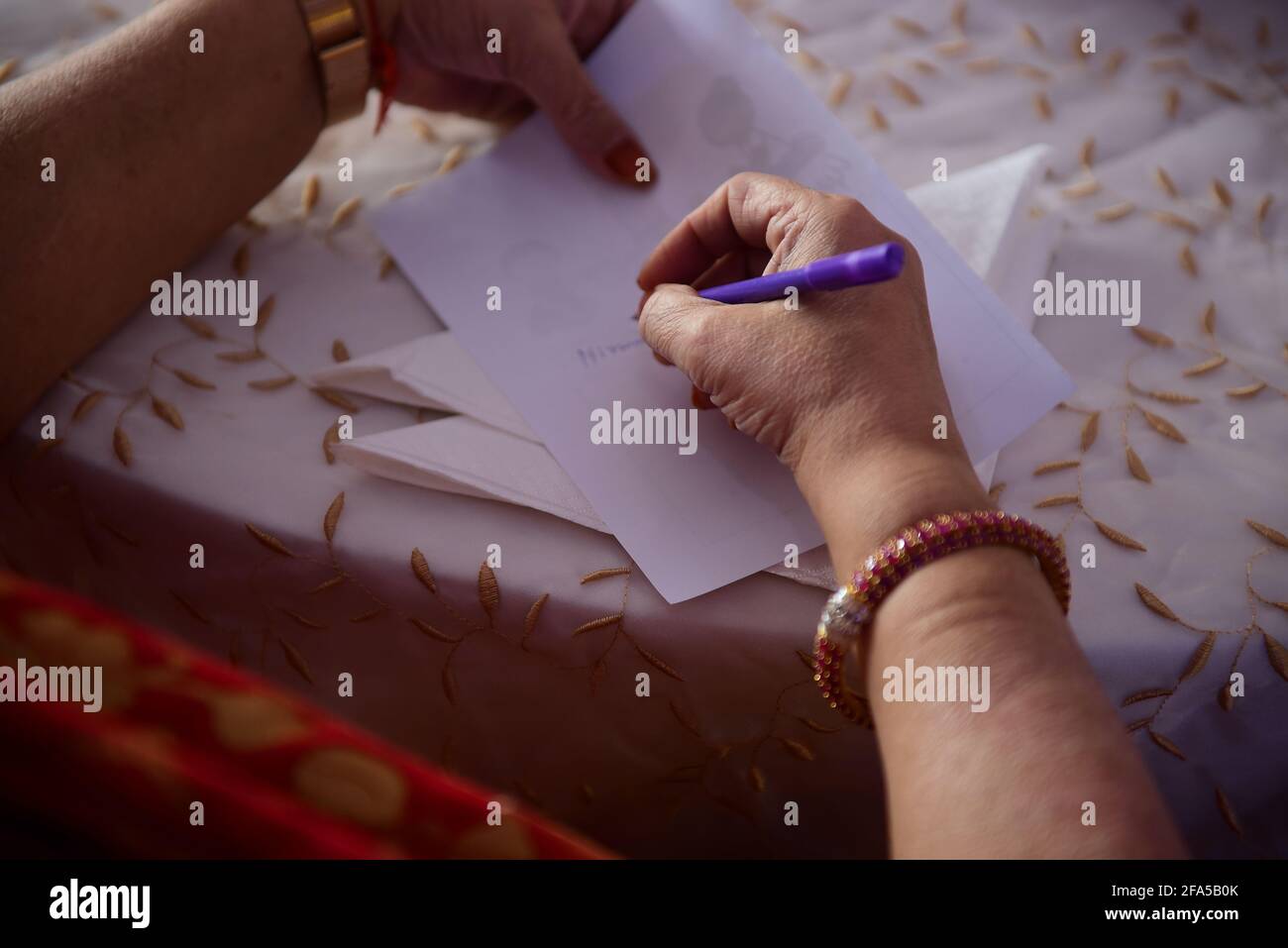 Person writing a letter on paper hi-res stock photography and images ...