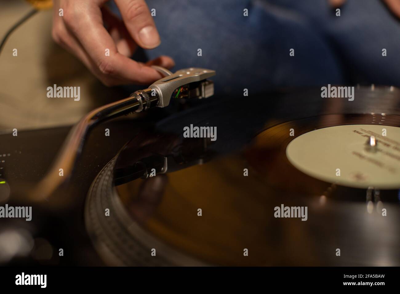 girl hands put needle on record on turntable close up. Musical Hobby ...