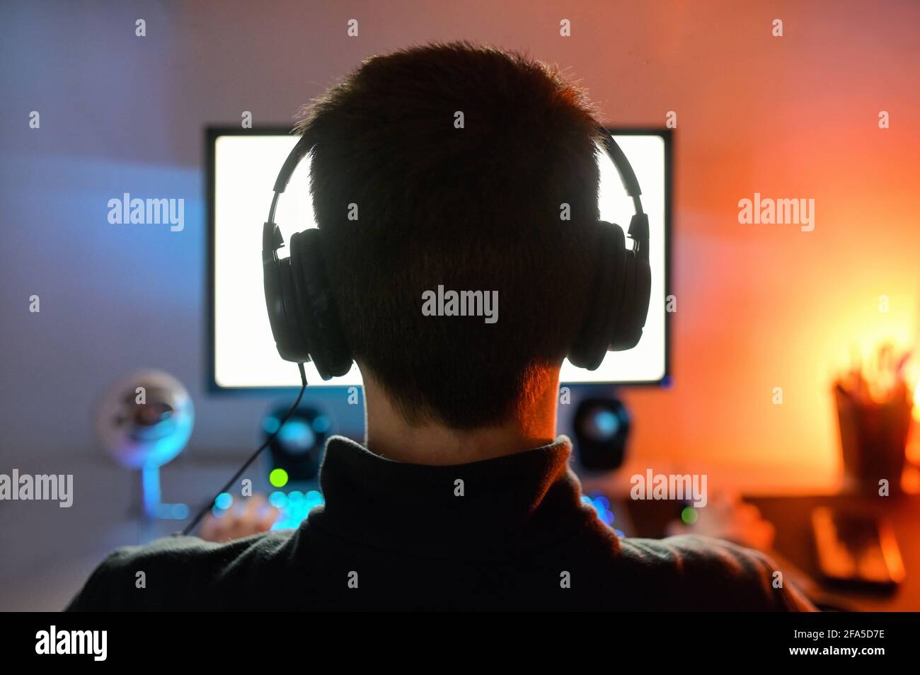 Young Man Playing A Video Game shoot from Behind Stock Photo - Alamy