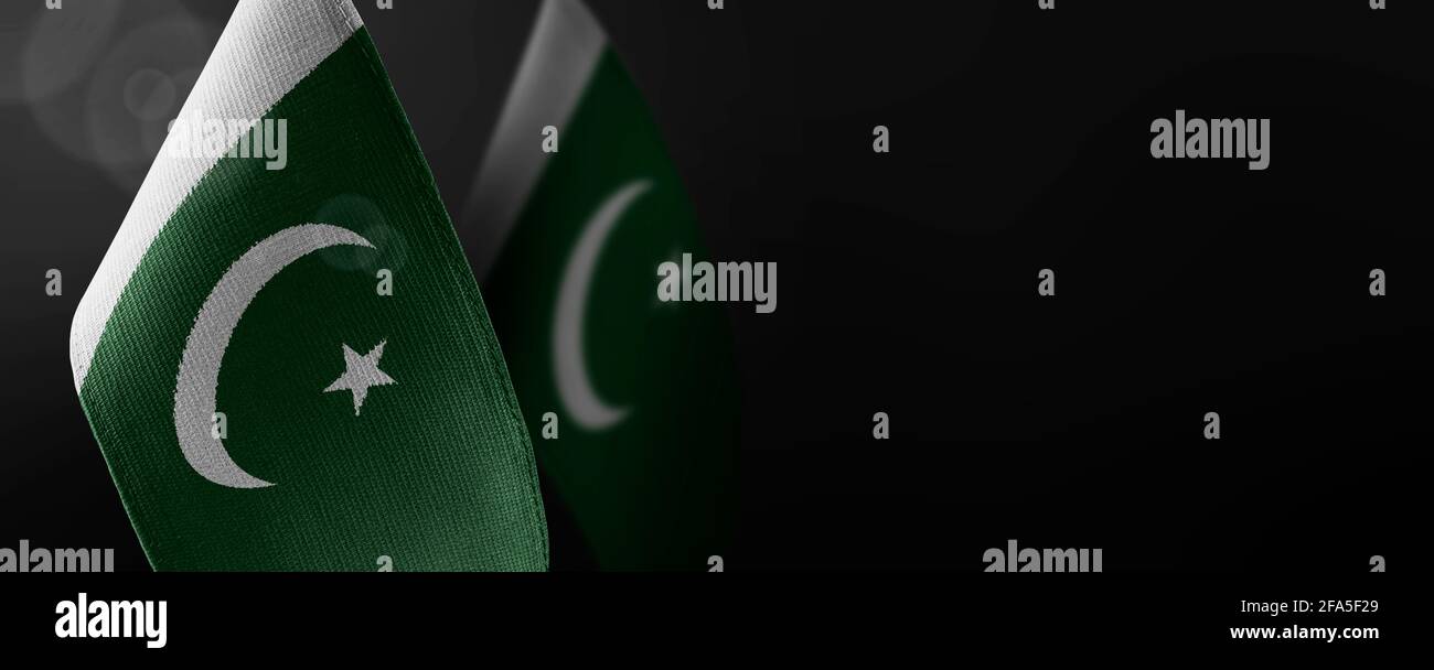 Small national flags of the Pakistan on a dark background Stock Photo ...