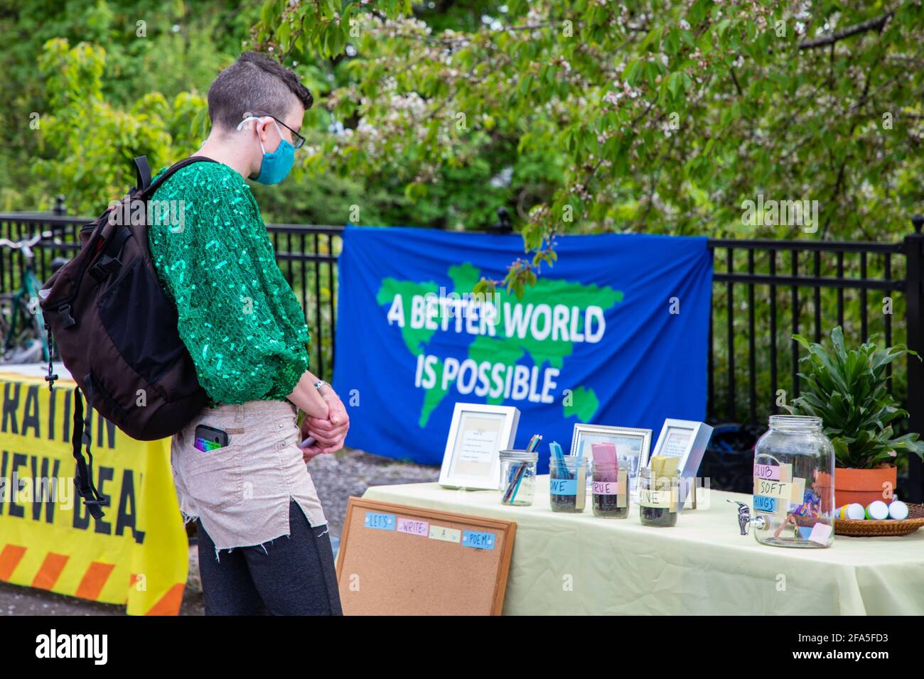 People attend an Earth Day celebration organized by the Sunrise ...