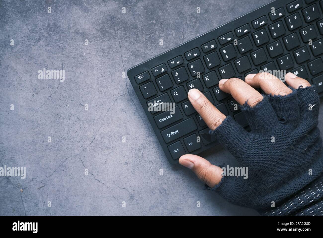 hacker hand stealing data from computer top down Stock Photo - Alamy