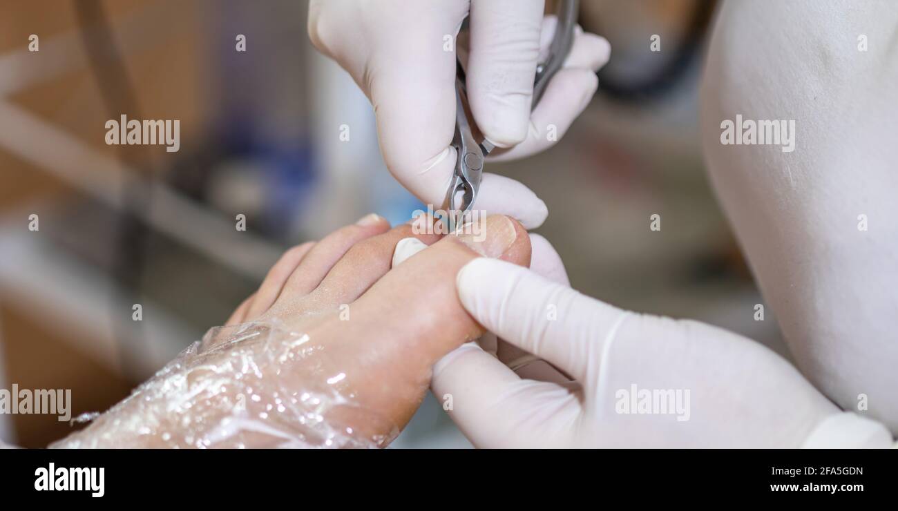 Female foot in process of pedicure procedure treatment stock photo ...