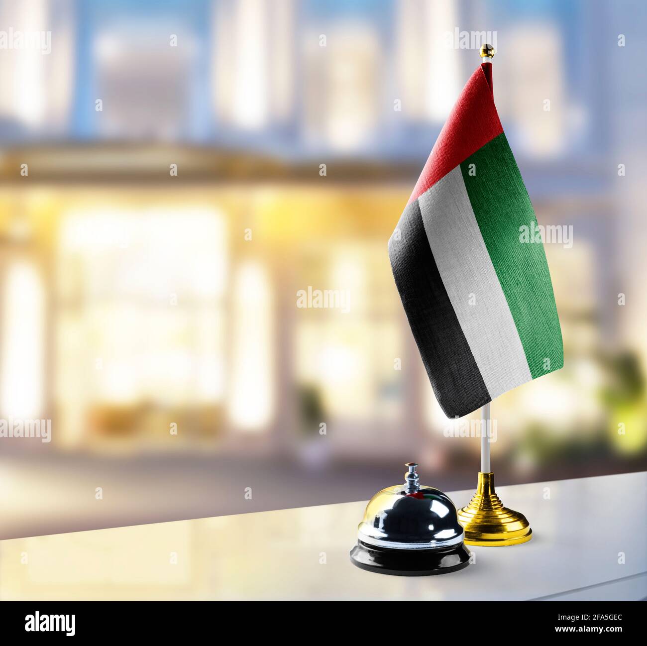 United Arab Emirates flag on the reception desk in the lobby of the ...