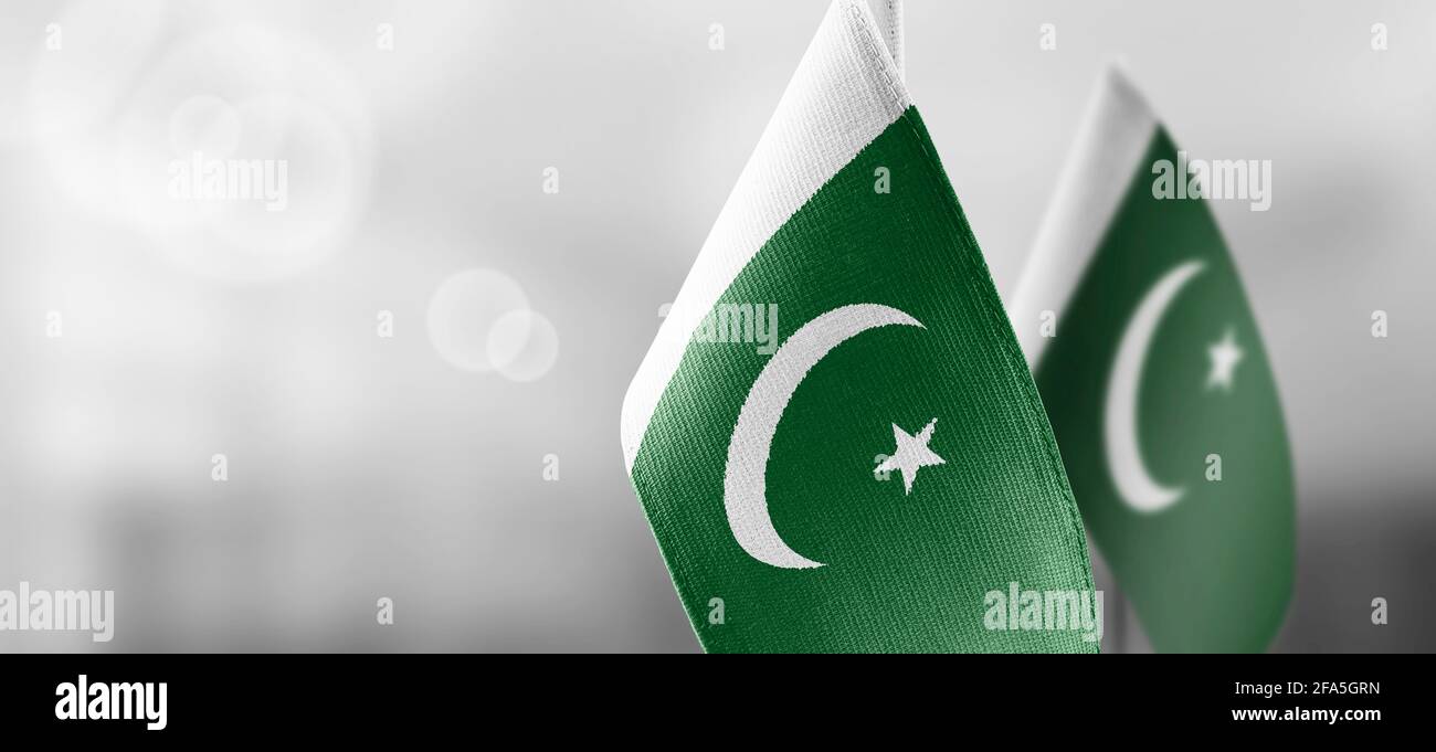 Small national flags of the Pakistan on a light blurry background Stock ...