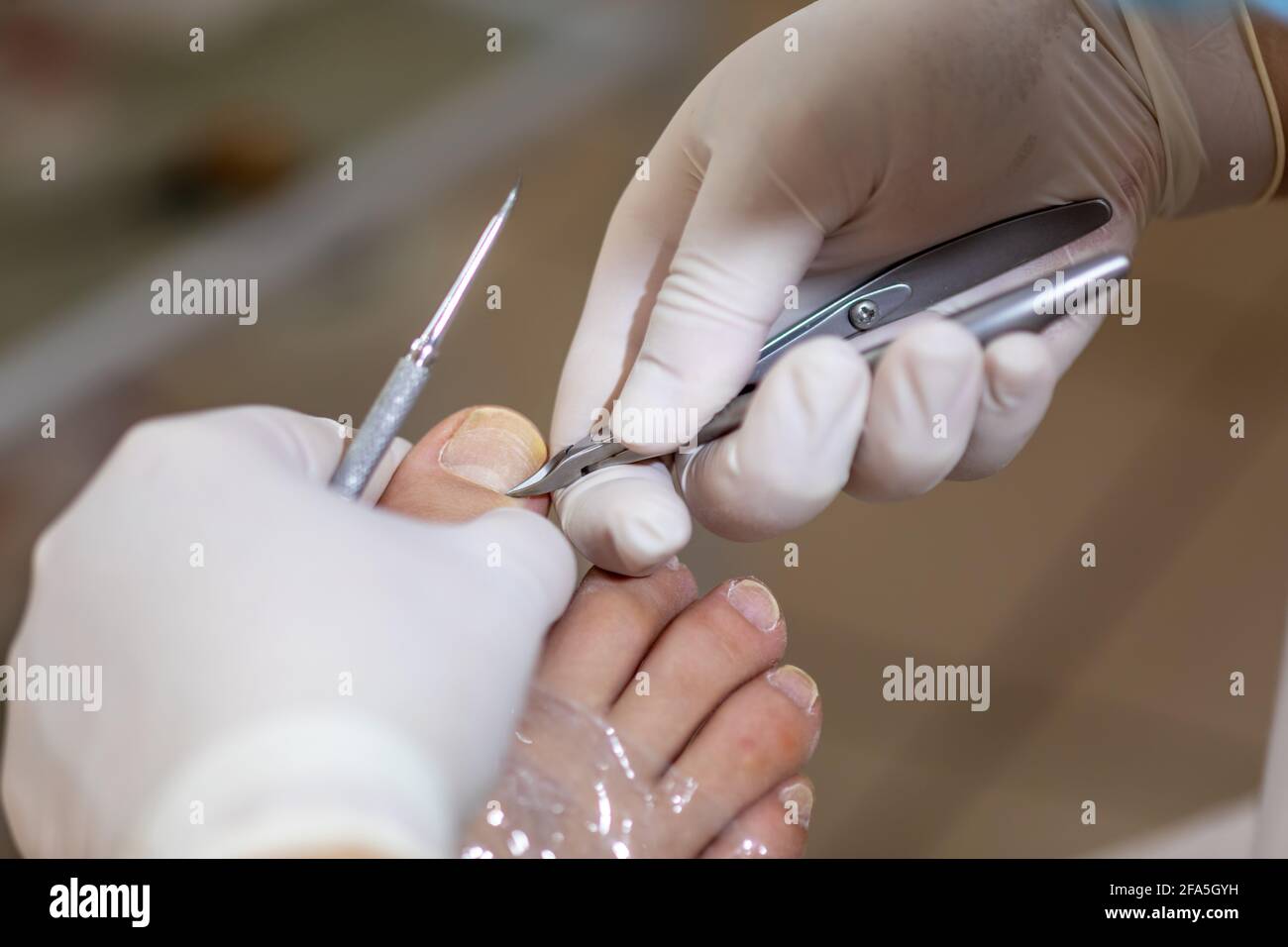 Female foot in process of pedicure procedure treatment stock photo ...