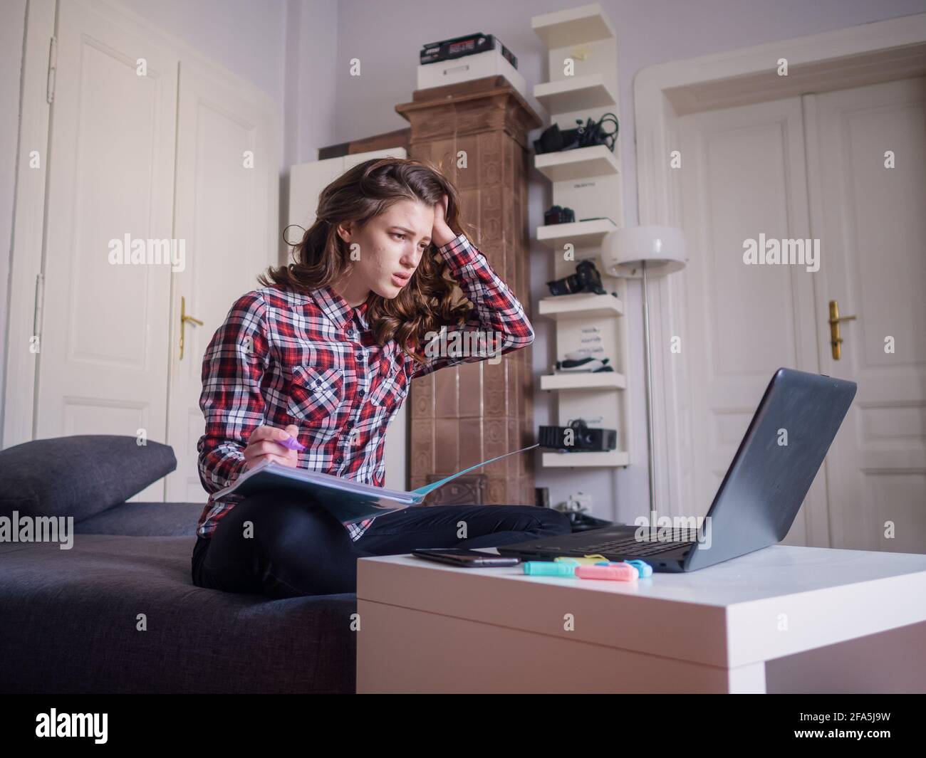 one young woman, looking at computer screen,overwhelmed emotion Stock ...