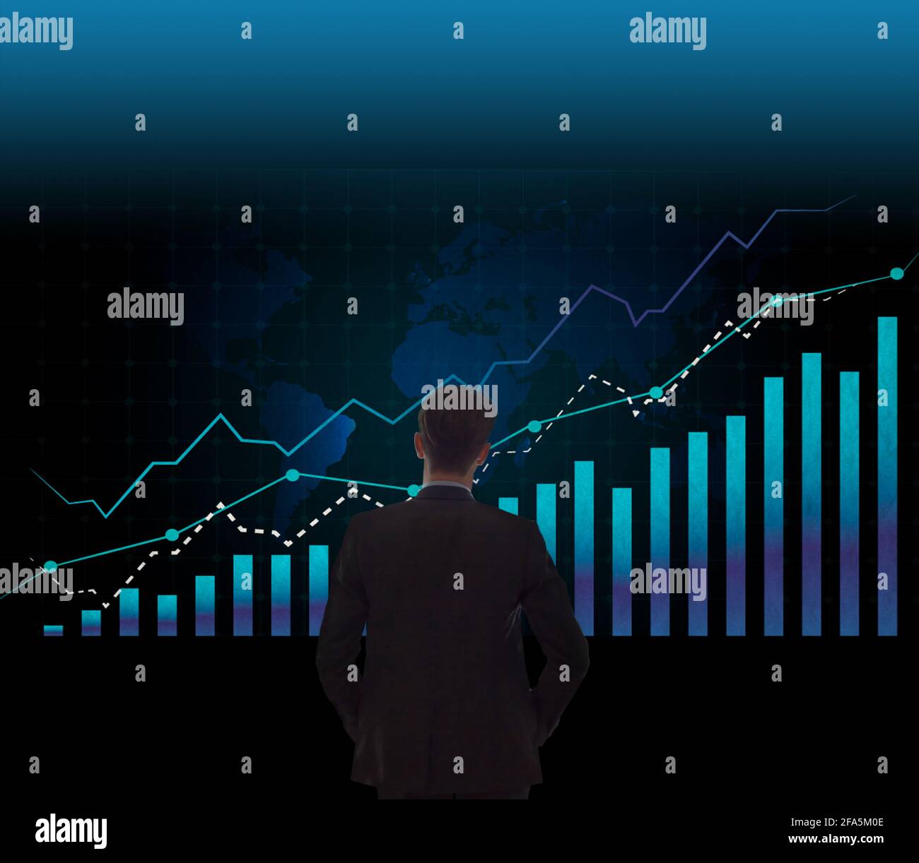 Back view of young businessman looking at forex chart and graphs on ...
