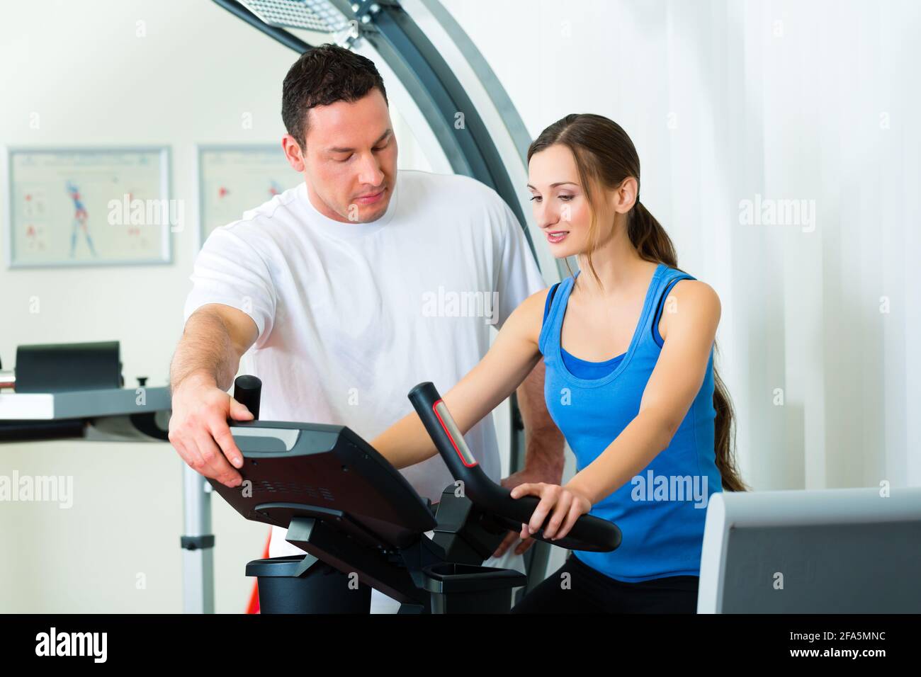 Patient at the physiotherapy making physical exercises with her ...