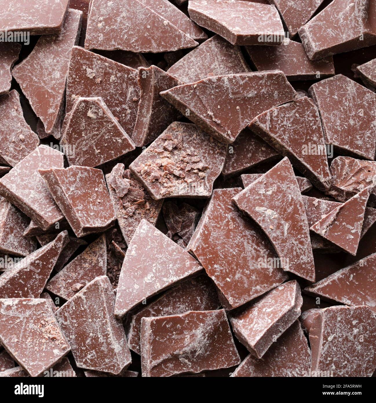 Chocolate pieces background. Directly above Stock Photo - Alamy
