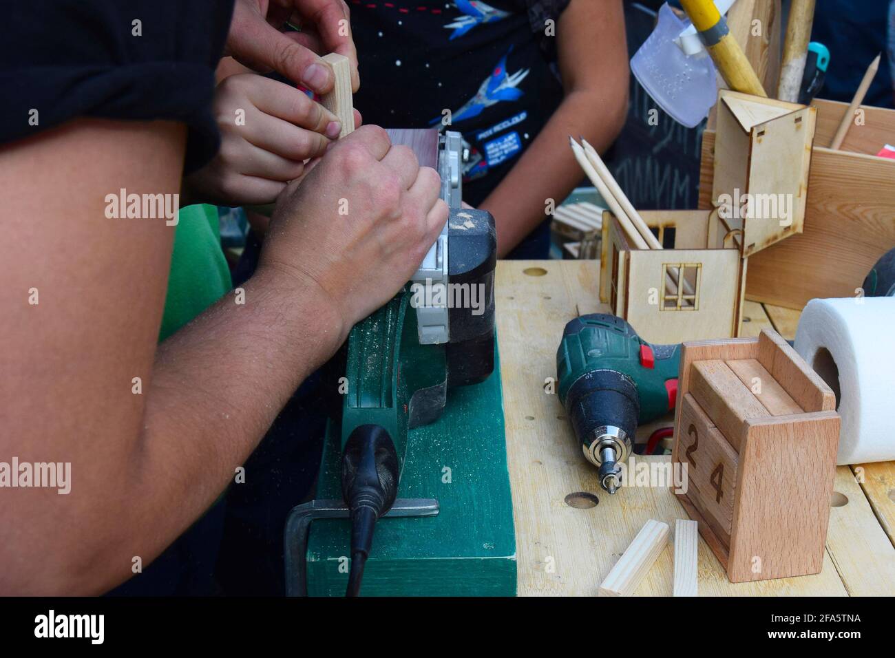 Training in carpentry. Carpenter's tools and hands. The carpenter works ...