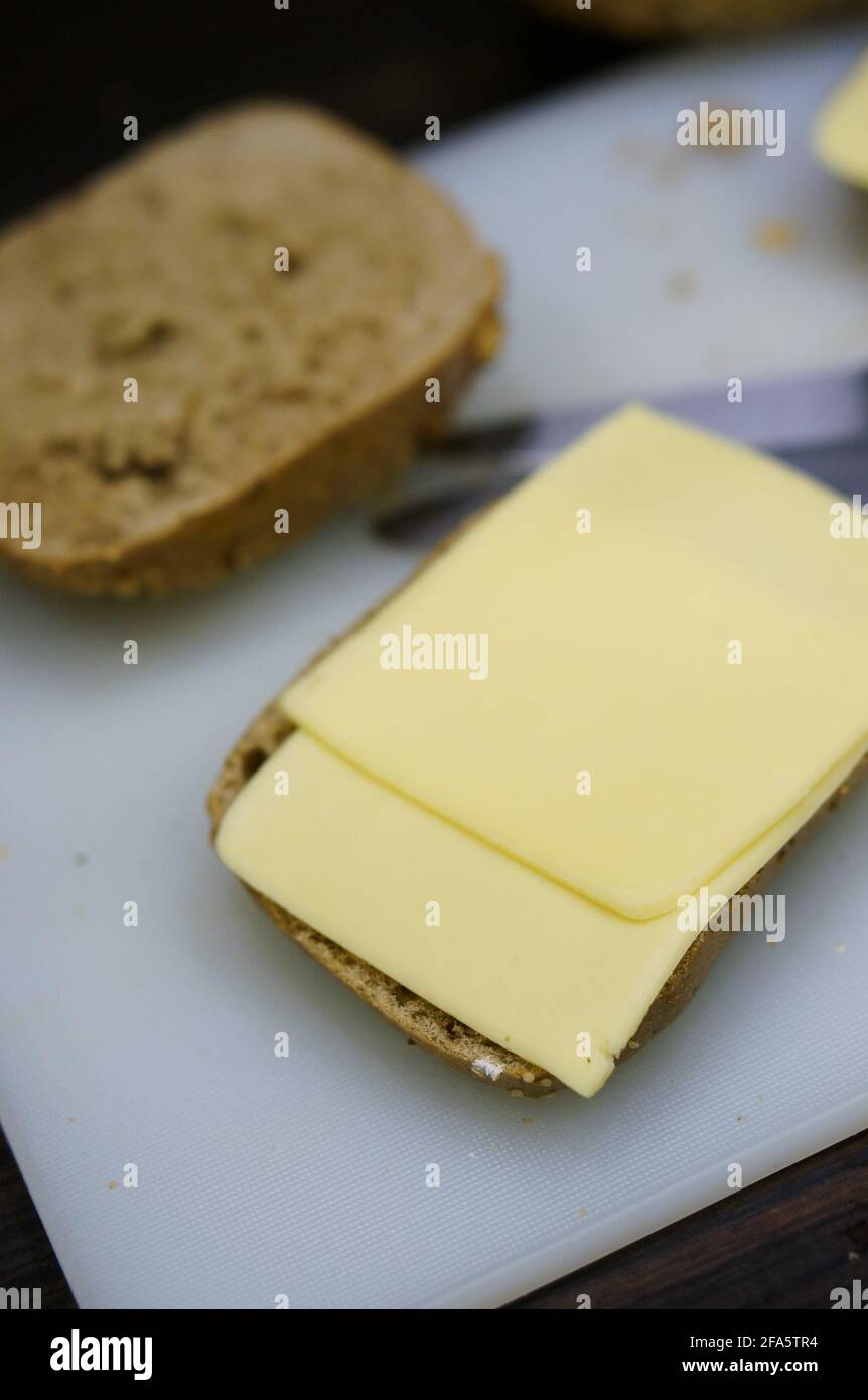 Bread and cheese on table Stock Photo - Alamy
