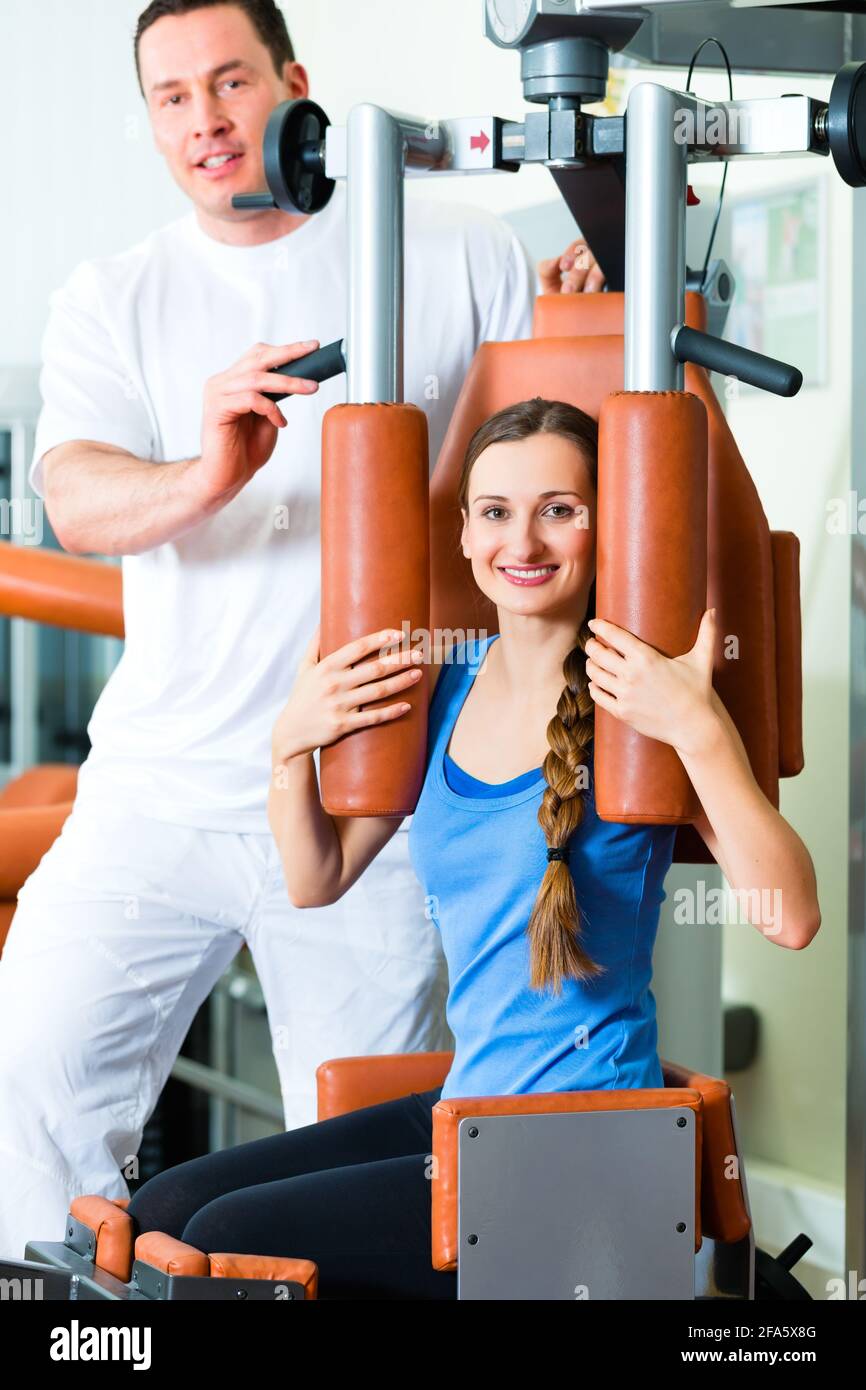 Patient at the physiotherapy making physical exercises with her ...