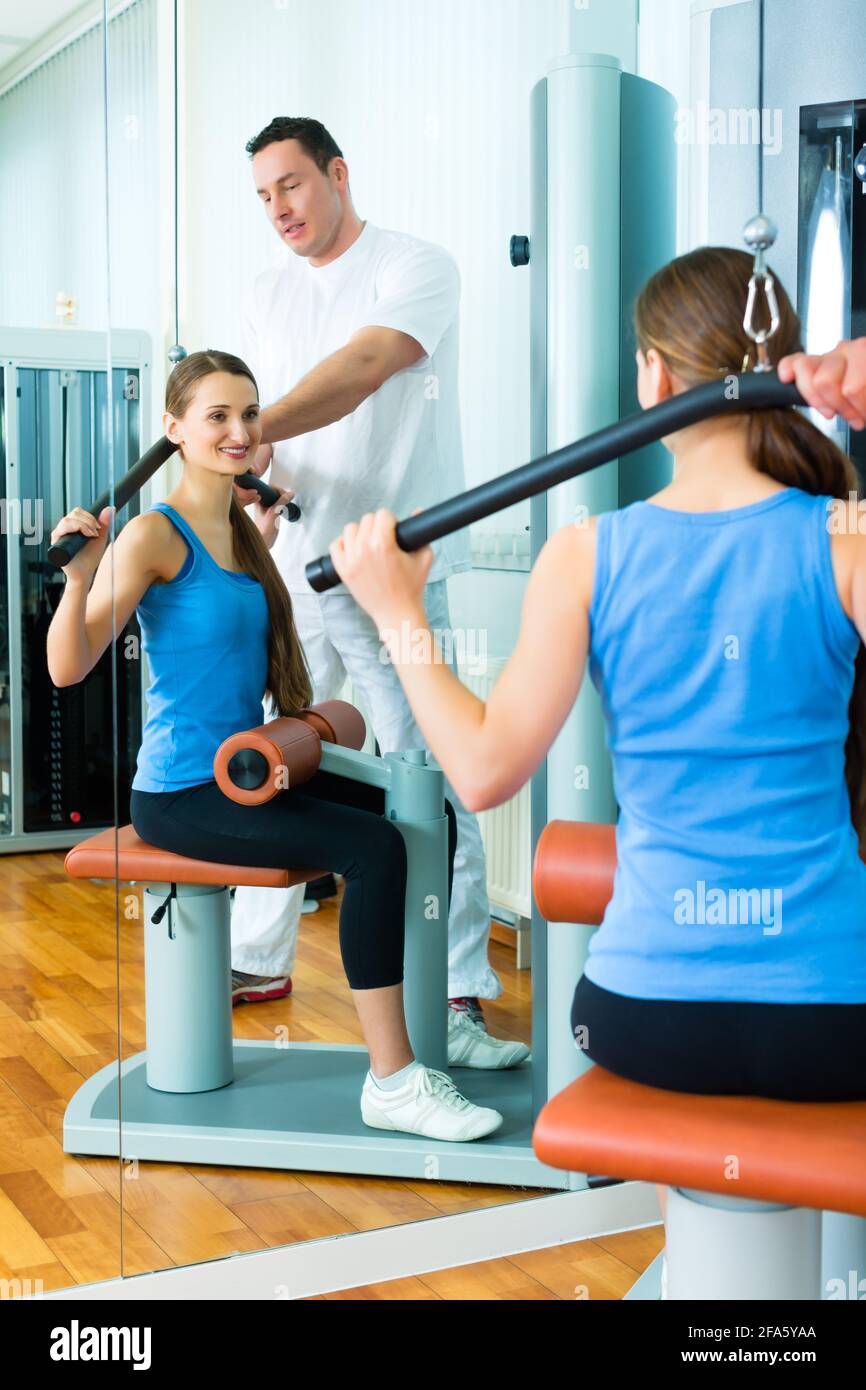 Patient at the physiotherapy making physical exercises with her ...