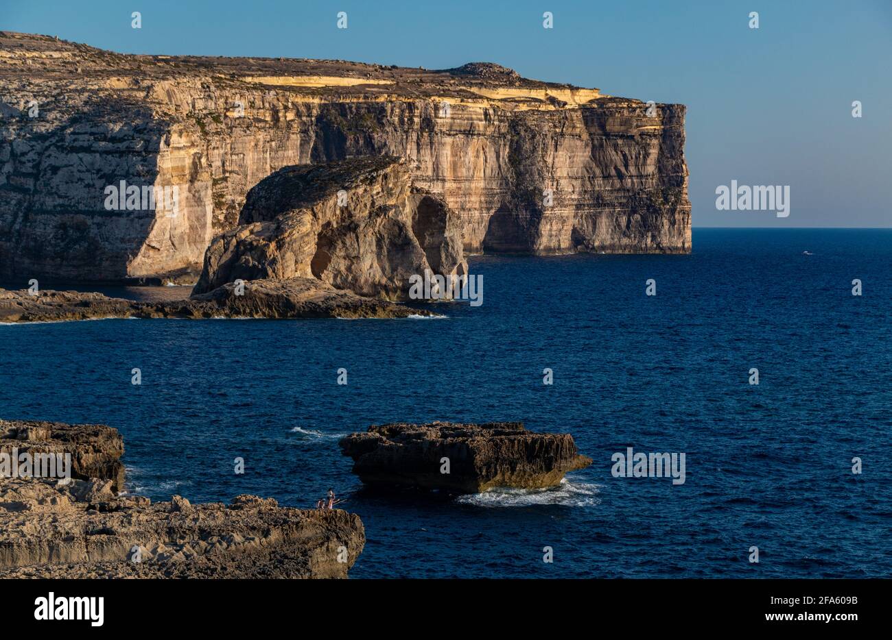 A picture of the rocky cliffs that dot the Gozo coast Stock Photo - Alamy