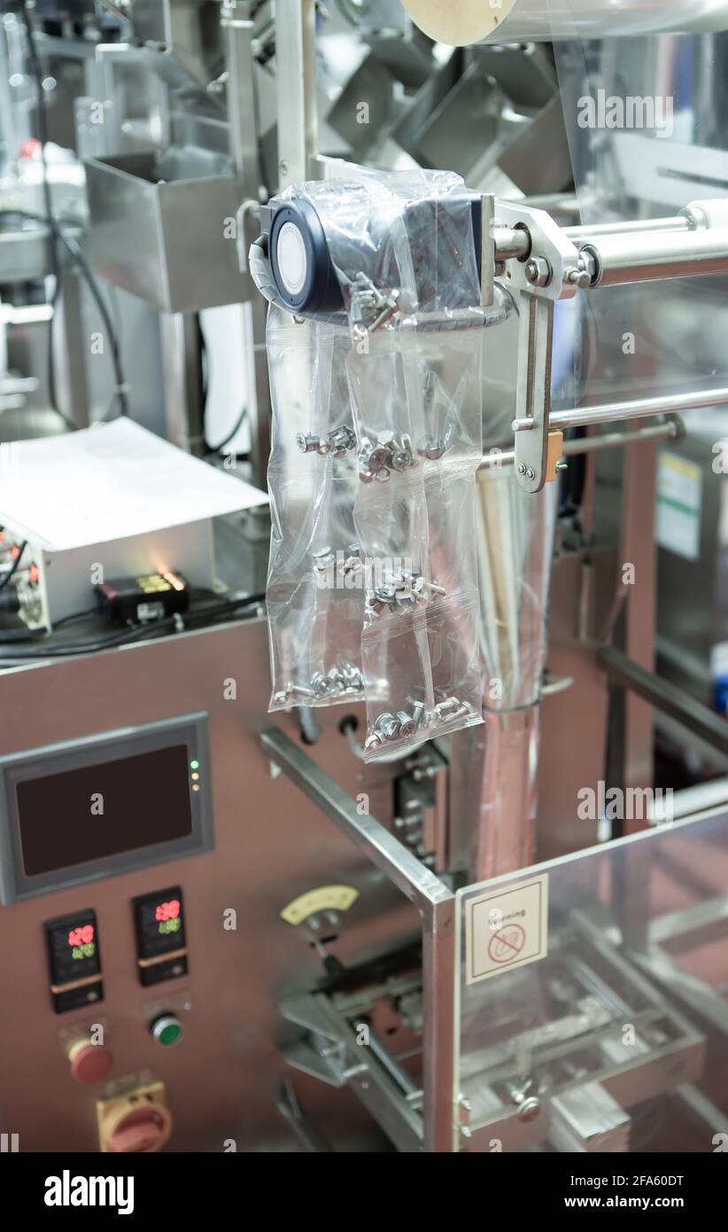 Automatic vertical hardware product nut and screw filling and packing ...