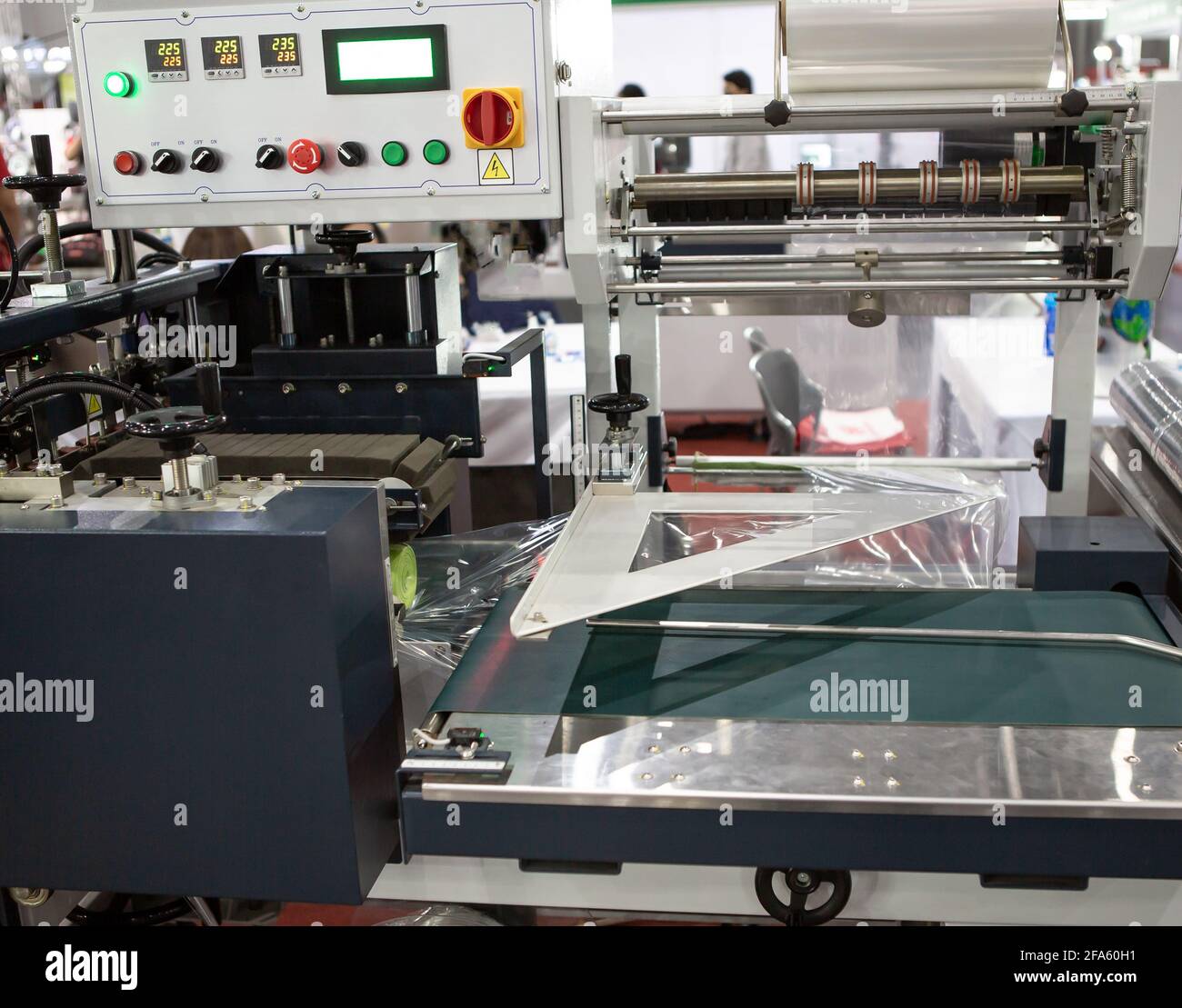 Package shrink film wraping machine in industrial warehouse Stock Photo ...