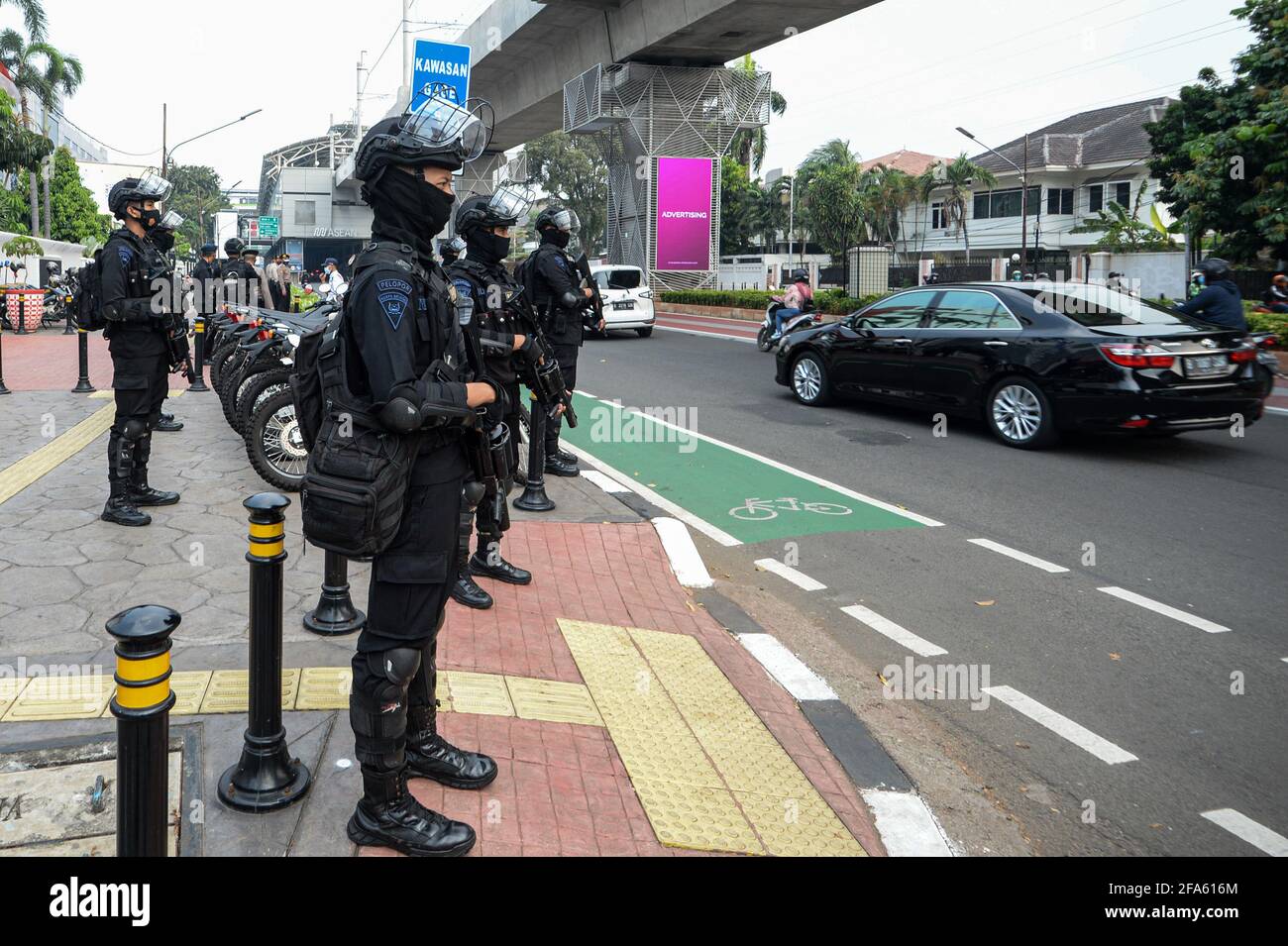 Jakarta, Indonesia. 23rd Apr, 2021. Indonesian police officers stand ...