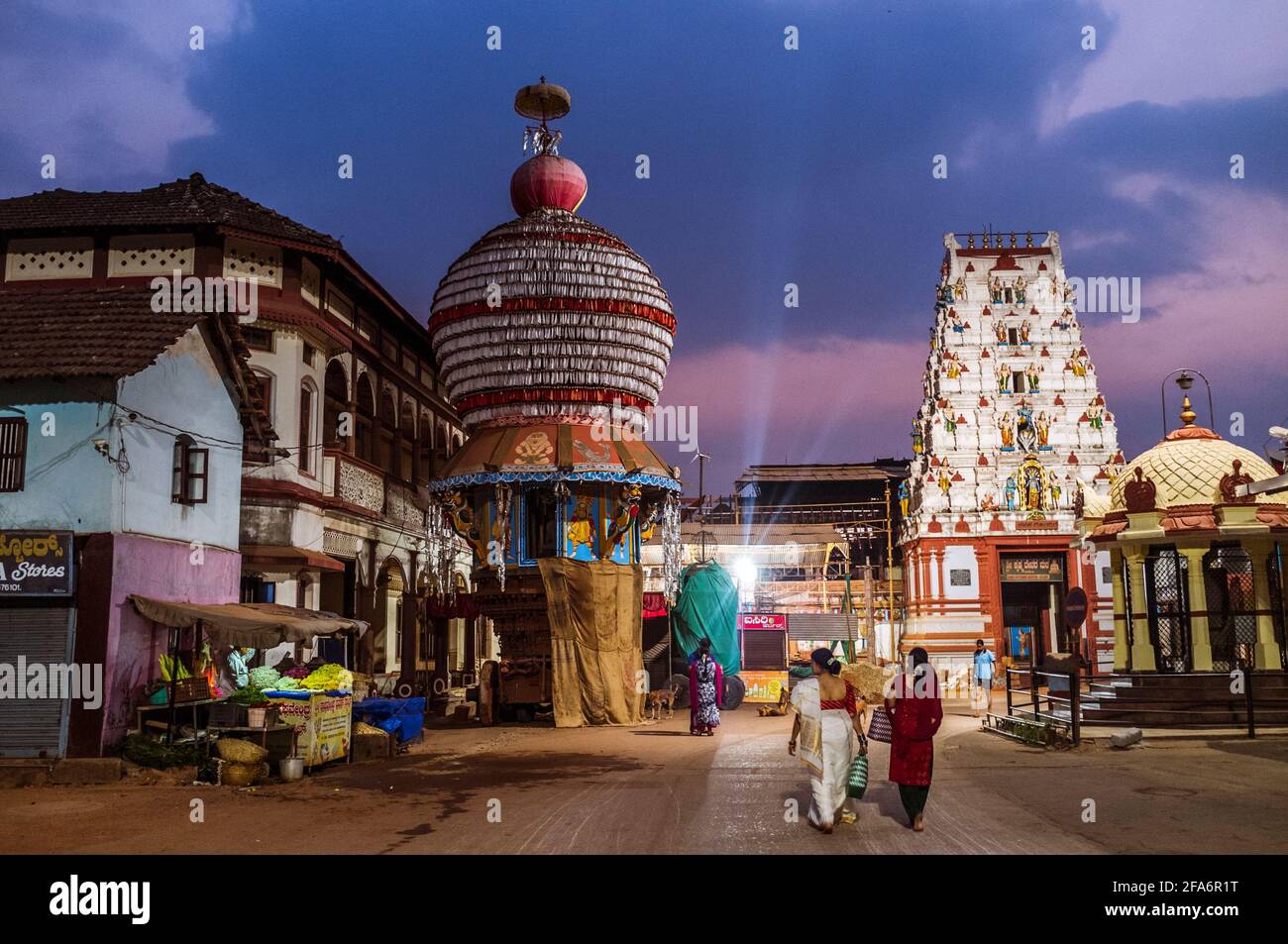 Udupi, Karnataka, India : Two women walk before dawn towards the 13th ...