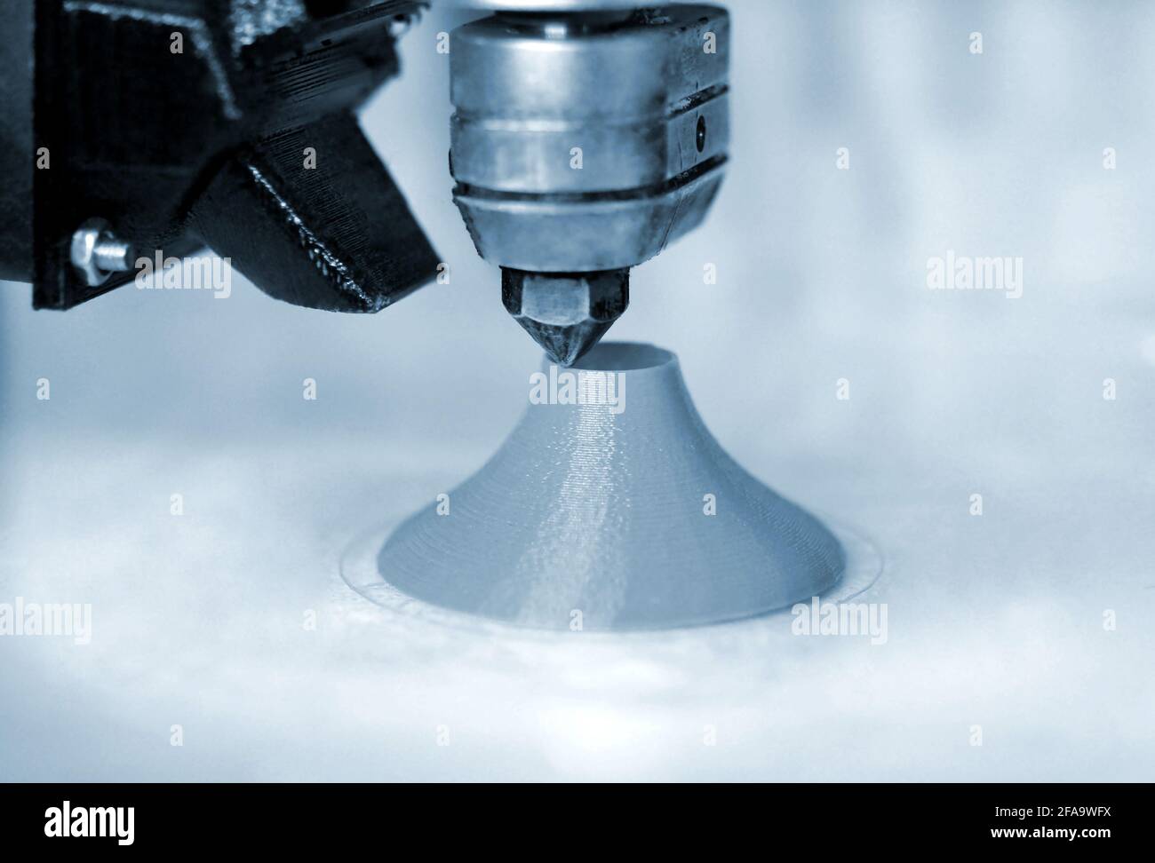 Modern 3D printer printing figure blue colors close-up Stock Photo - Alamy