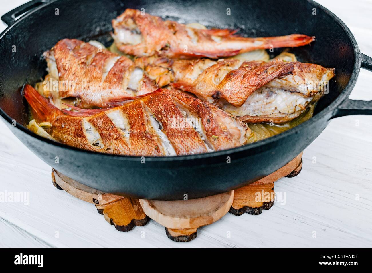 Fried sea bass fish. ish lunch meal cooking cuisine Stock Photo - Alamy
