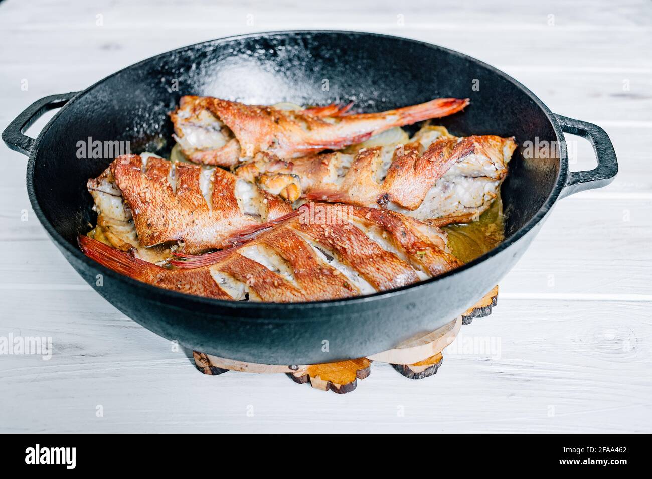 Fried sea bass fish. ish lunch meal cooking cuisine Stock Photo - Alamy