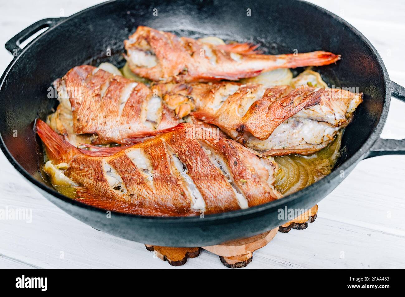 Fried sea bass fish. ish lunch meal cooking cuisine Stock Photo - Alamy