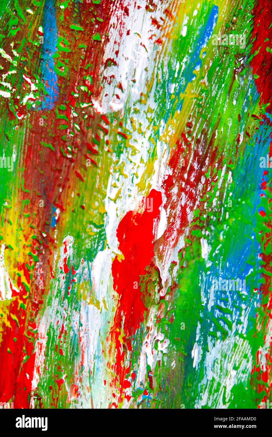 Background from different strokes of red, yellow, green and blue paint ...