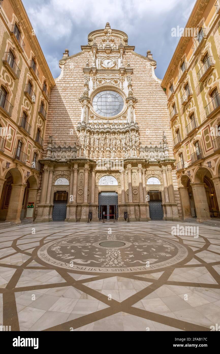 Montserrat, Barcelona - Spain. July 15, 2020: Facade and mosaic floorof ...