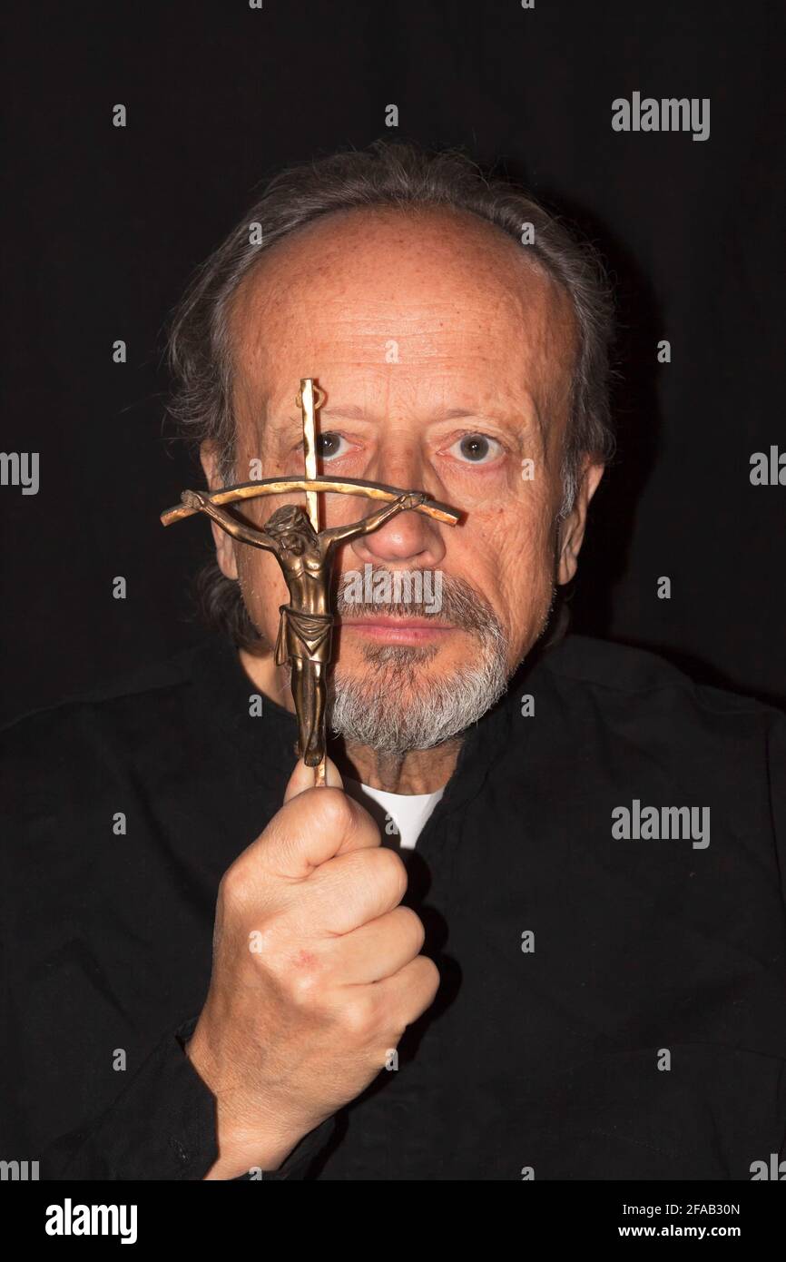 Priest with cross Stock Photo - Alamy
