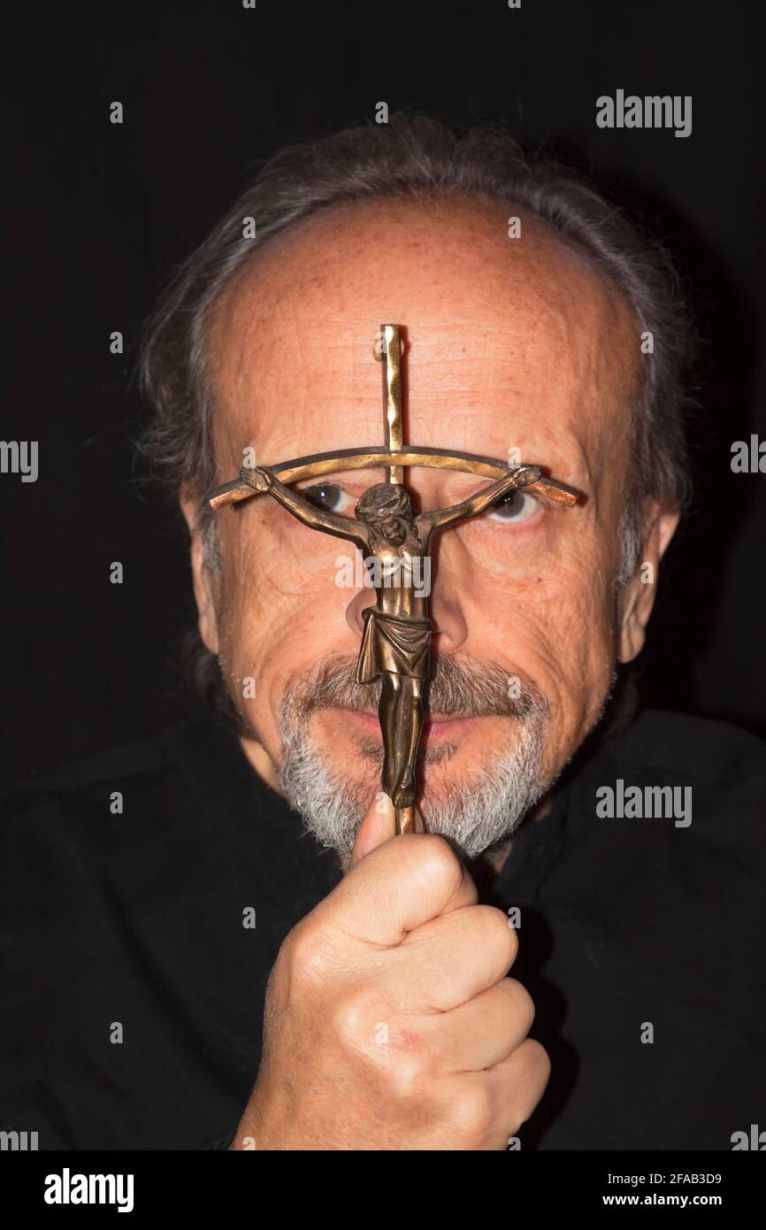 Priest with cross Stock Photo - Alamy